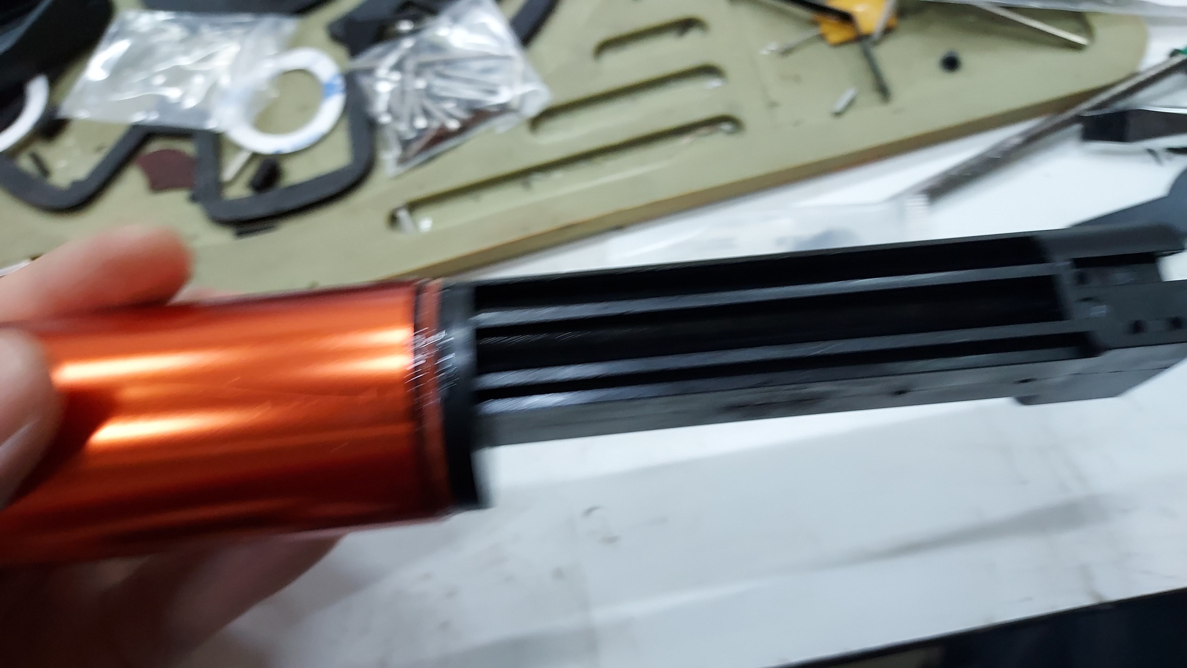 Once the breech and plunger rod are lubricated, place them together ...