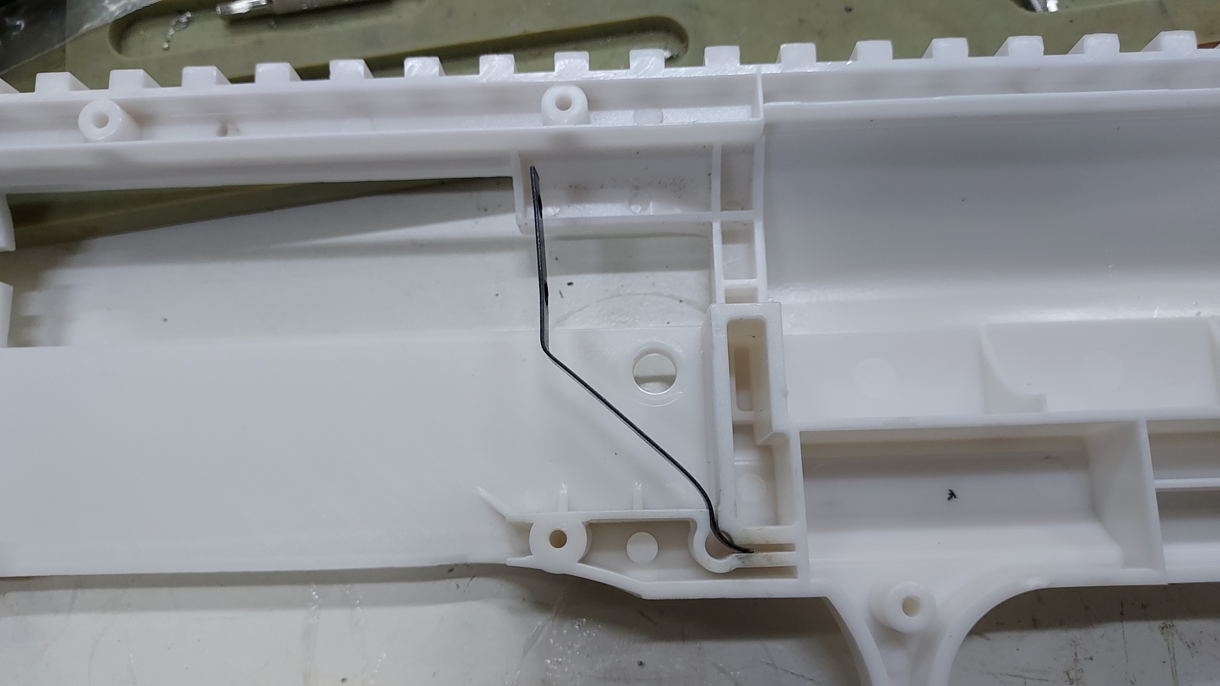 Prepared shell lifter spring in right side of receiver shell.