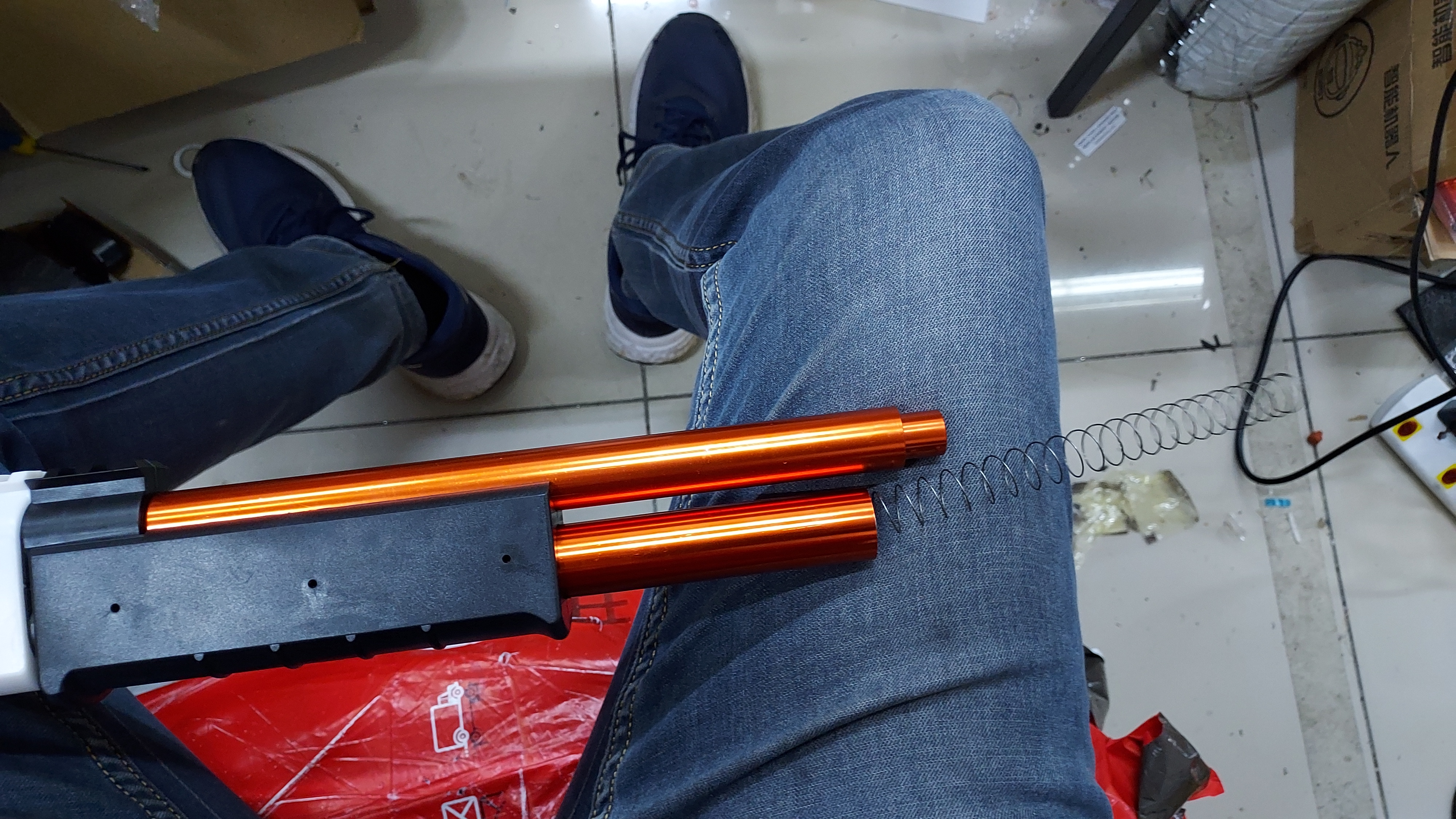 Mag tube follower and spring installed inside the magazine tube.