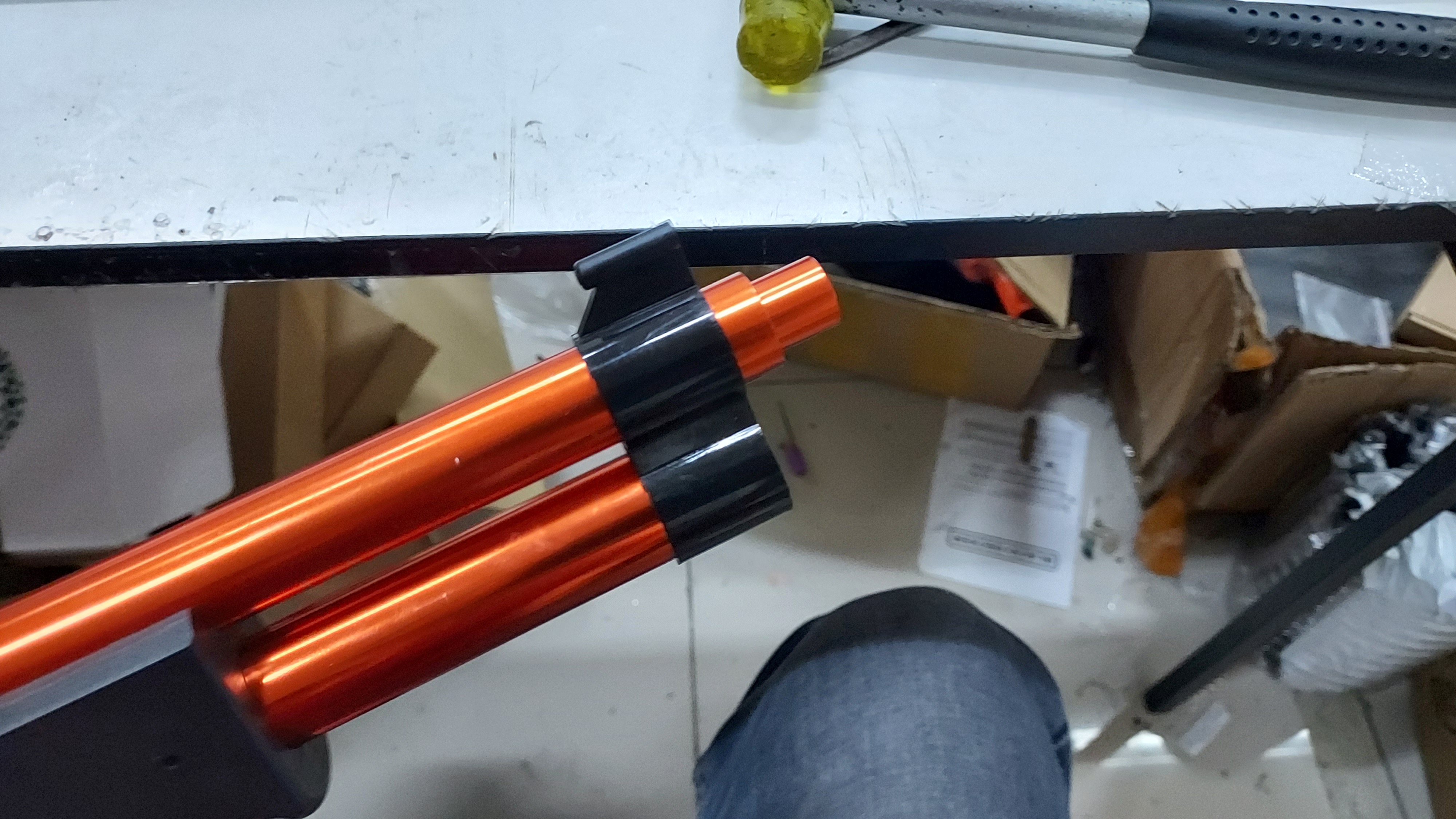 Lastly, place the priming bar on top of the pump grip cut-out and ...
