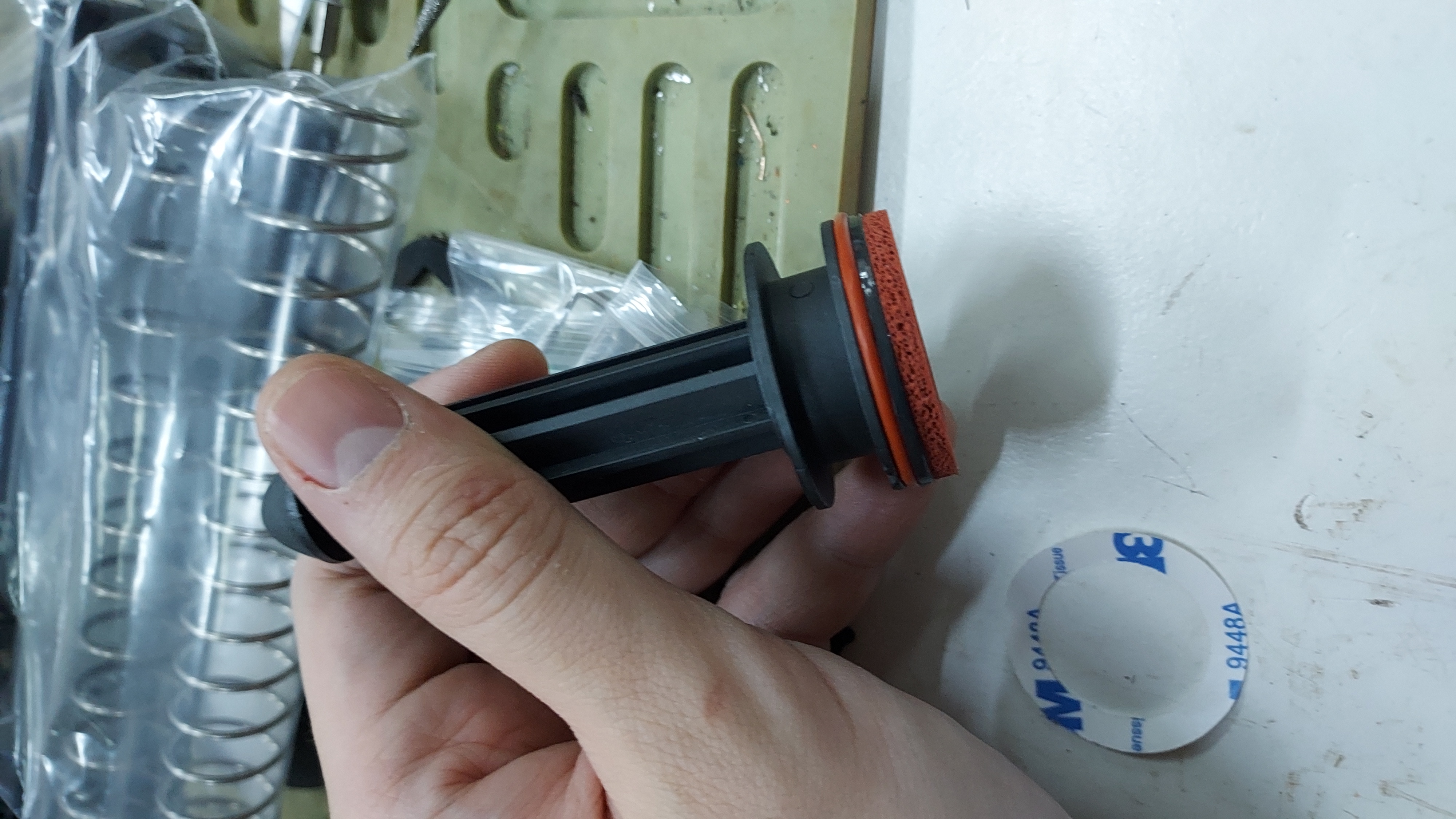 After completing the plunger rod piece, place the last remaining o-ring ...