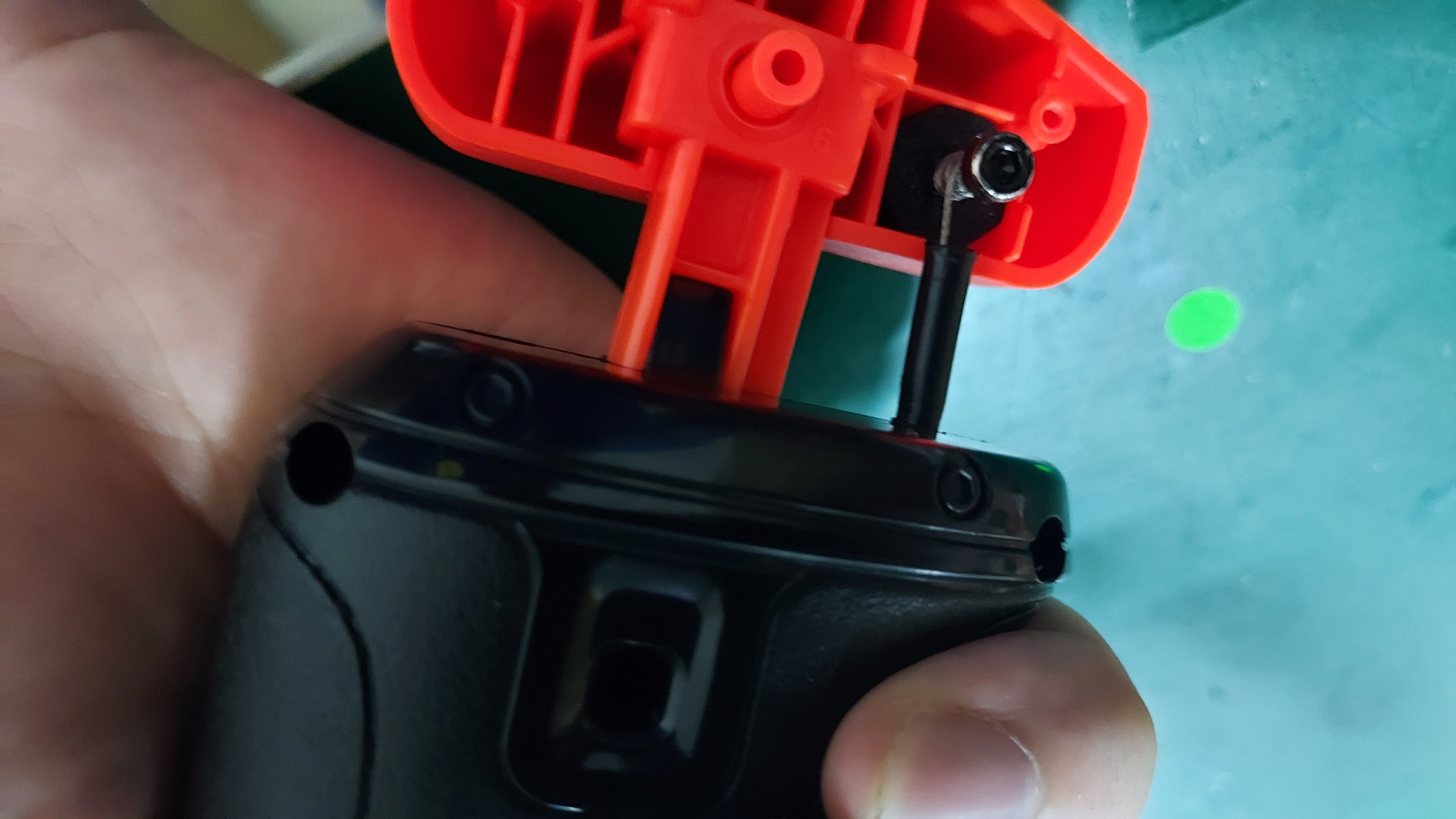 Step 3: Sand down the trigger wing and flatten a part of the catch plate.